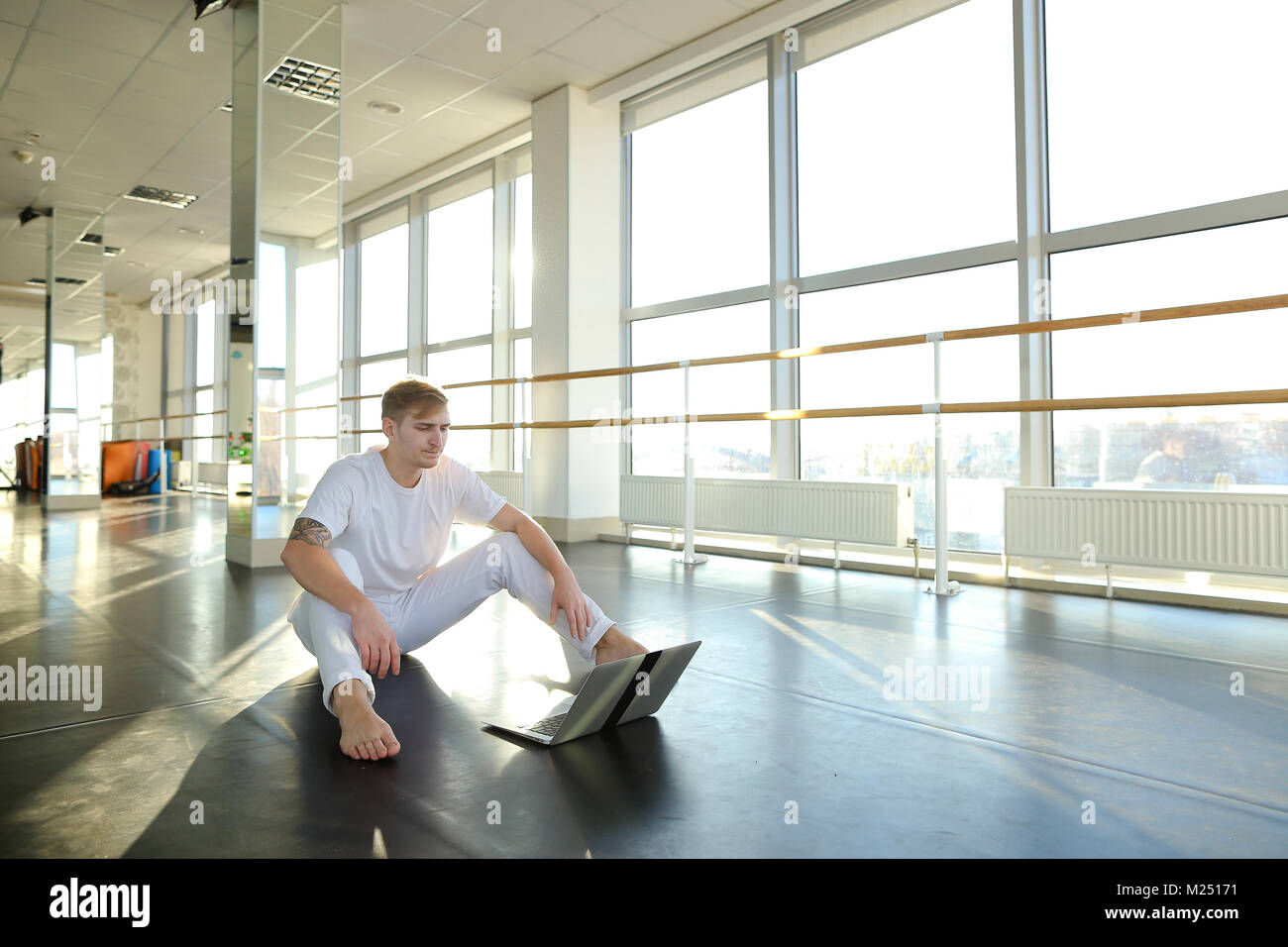 Young man learning new dancing technique with laptop tutorial Stock ...