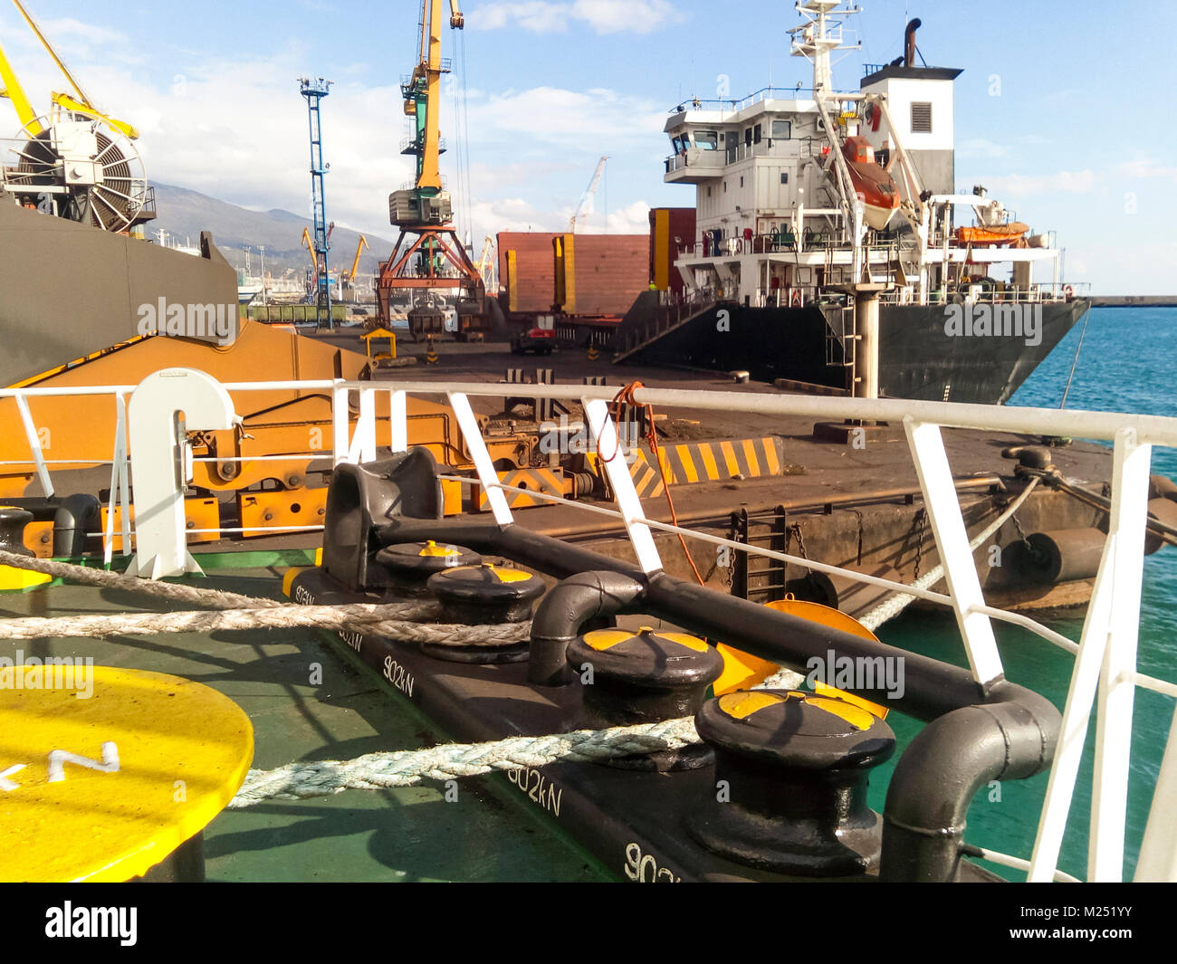 Mooring bollard on the decks of an industrial seaport Stock Photo - Alamy