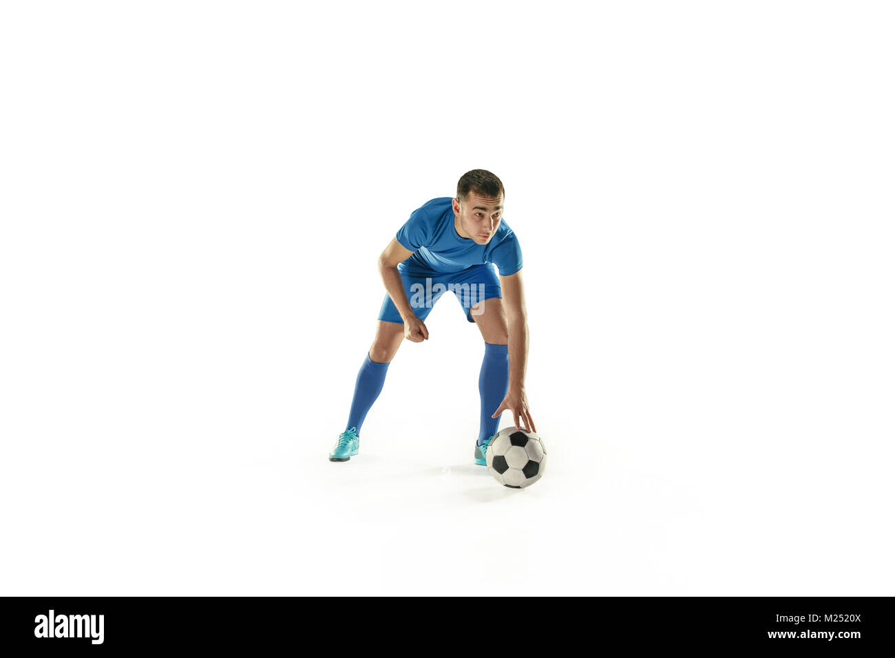 Professional football soccer player with ball isolated white background ...