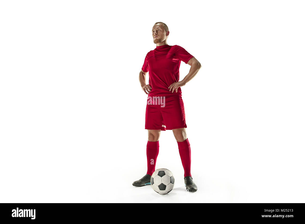 Professional football soccer player with ball isolated white background ...