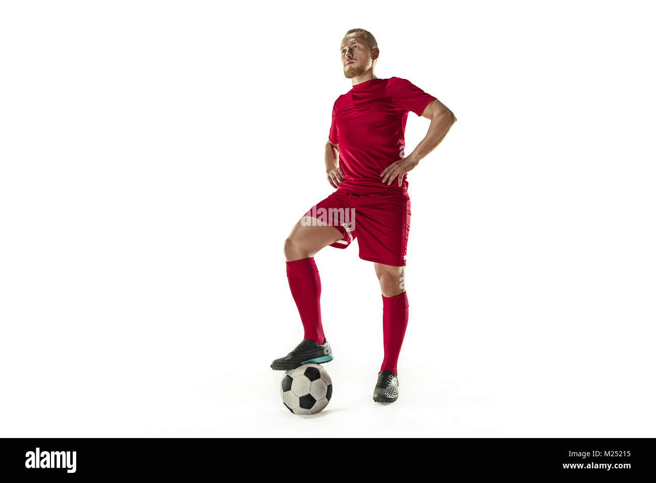 Professional football soccer player with ball isolated white background ...
