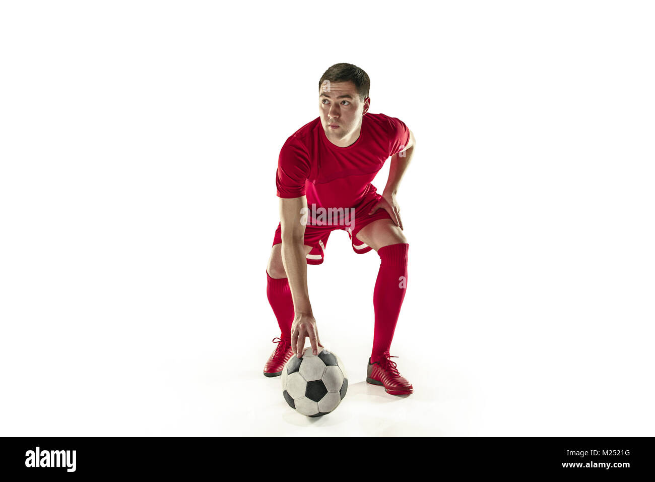Professional football soccer player with ball isolated white background ...