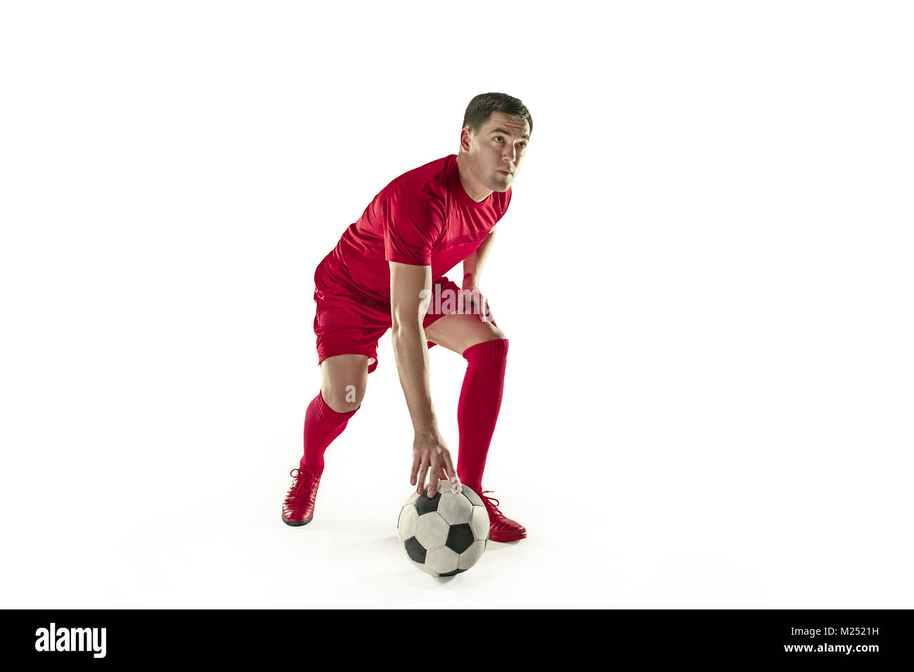 Professional football soccer player with ball isolated white background ...