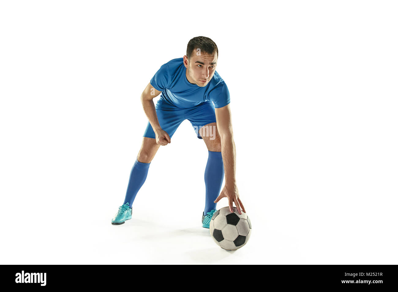 Professional football soccer player with ball isolated white background ...