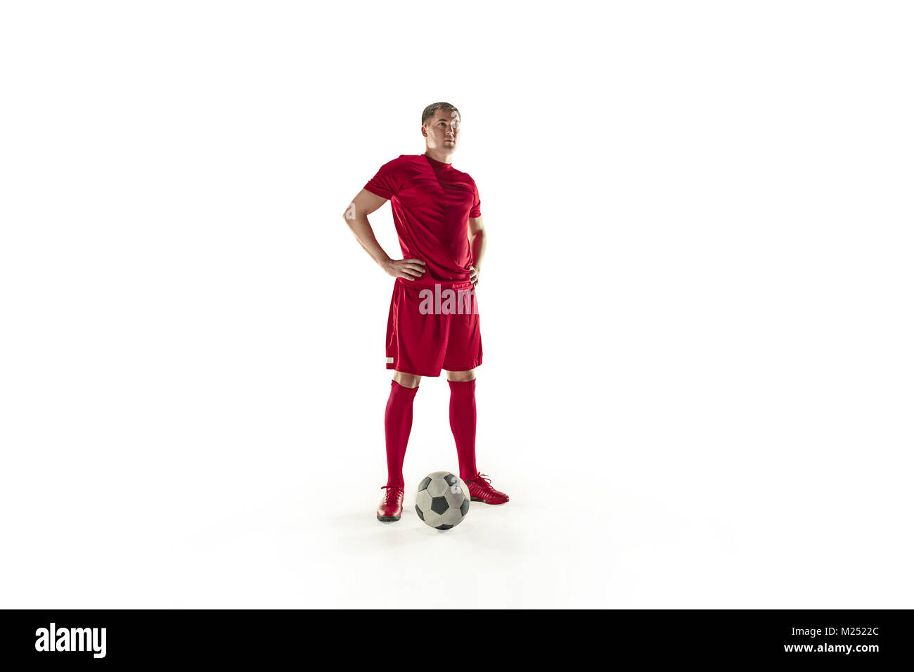 Professional football soccer player with ball isolated white background ...