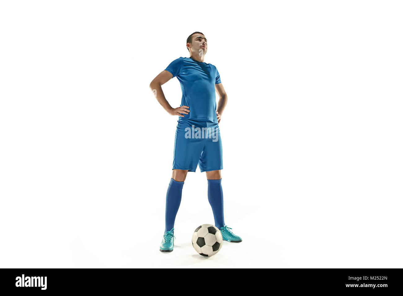 Professional football soccer player with ball isolated white background ...