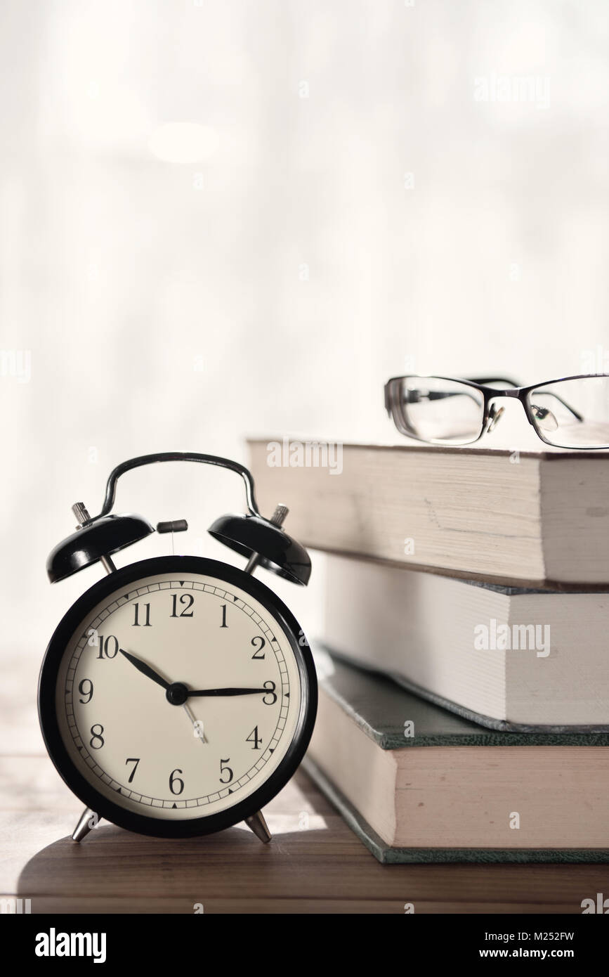 Vintage alarm clock and books hi-res stock photography and images - Alamy
