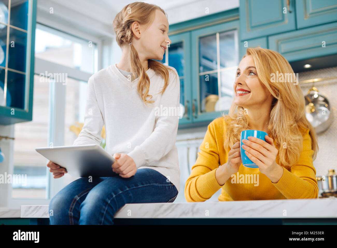 Content mother and daughter spending weekend together Stock Photo - Alamy
