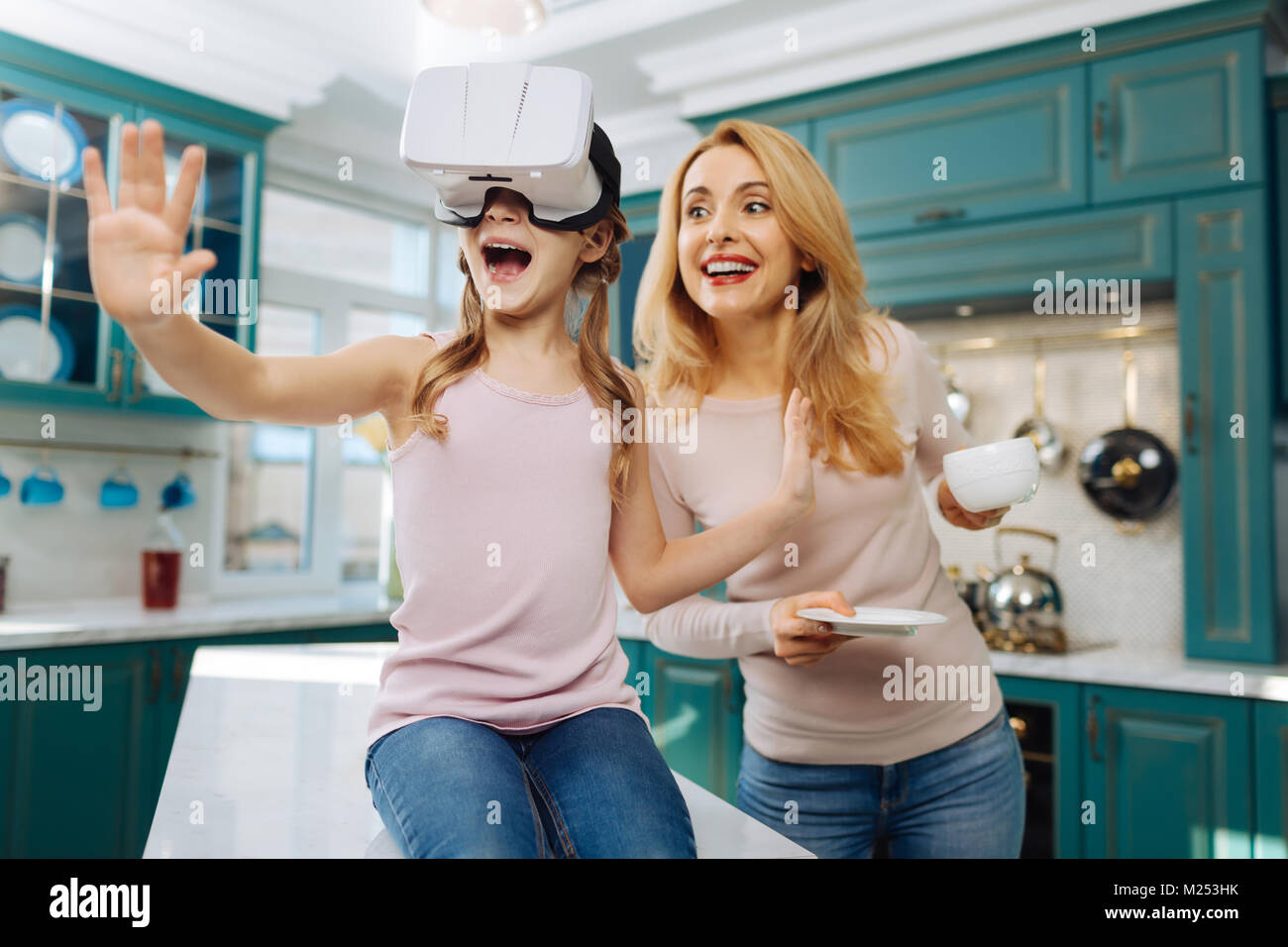 Joyful child wearing VR headset Stock Photo - Alamy