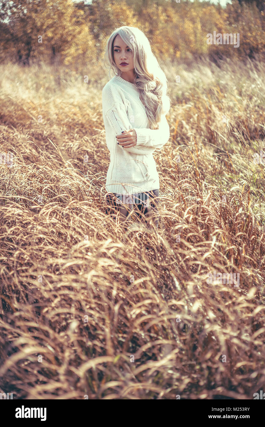 Outdoor atmospheric fashion photo of young beautiful lady in autumn ...