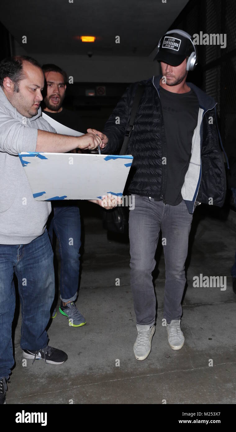 Chris Hemsworth signs autographs for fans as he arrives at Los Angeles ...