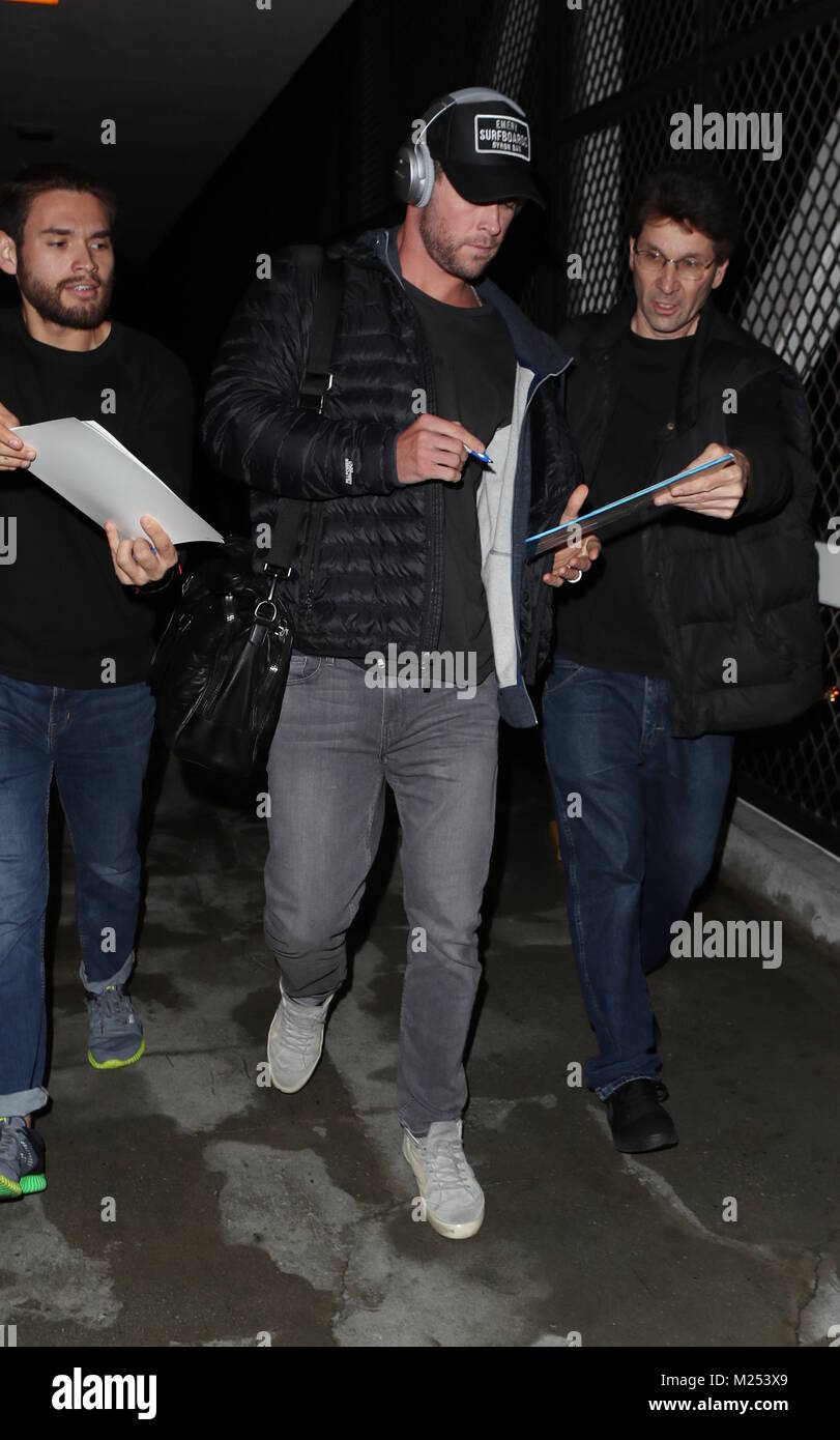 Chris Hemsworth signs autographs for fans as he arrives at Los Angeles ...