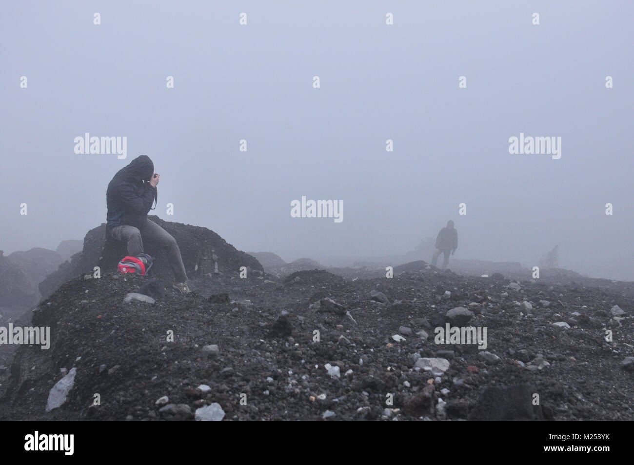 Climbing the volcano Semeru, Indonesia. Crater covered with debris and ...