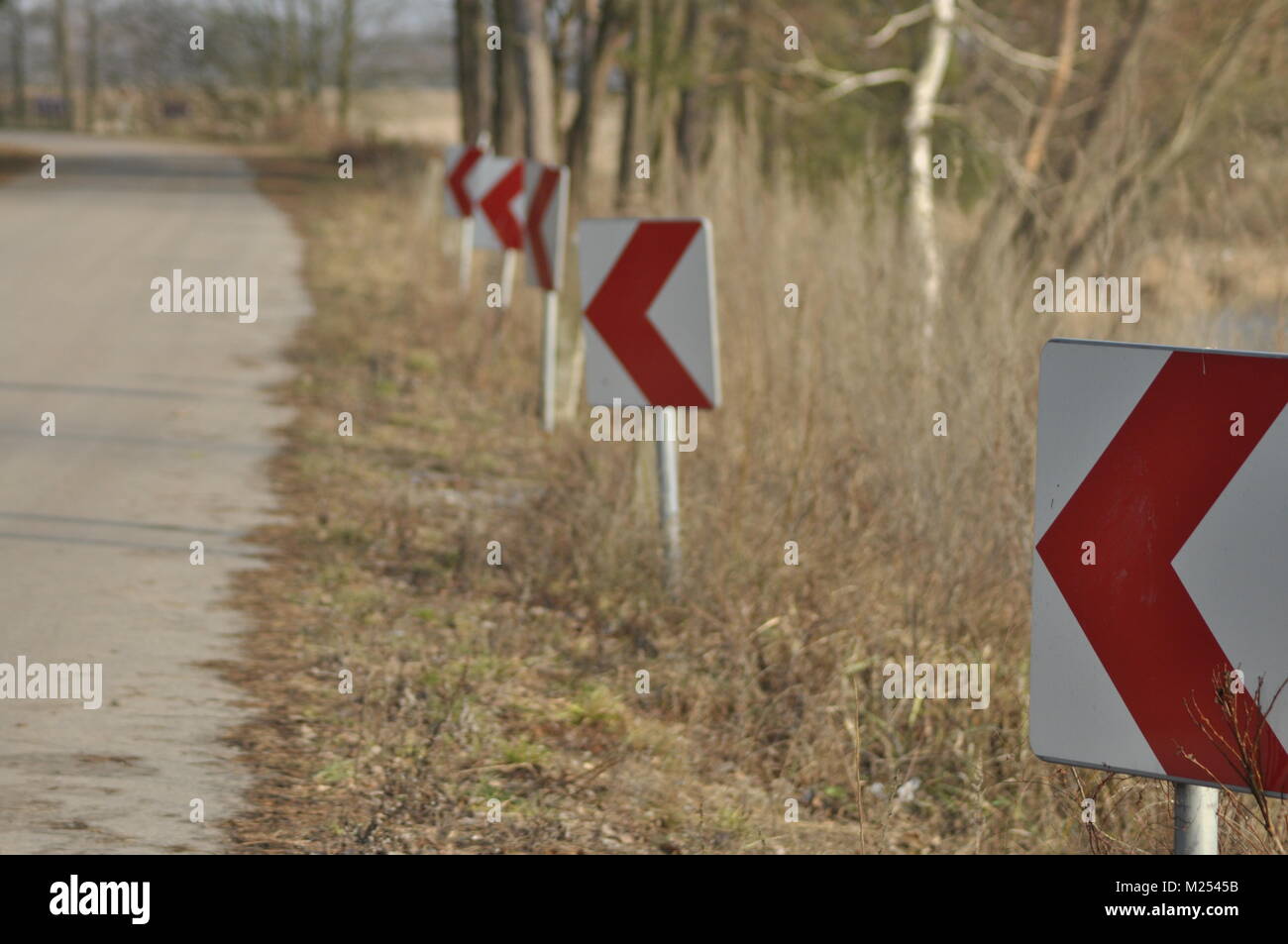 Road signs, the sign of the bend. Winding road Stock Photo - Alamy