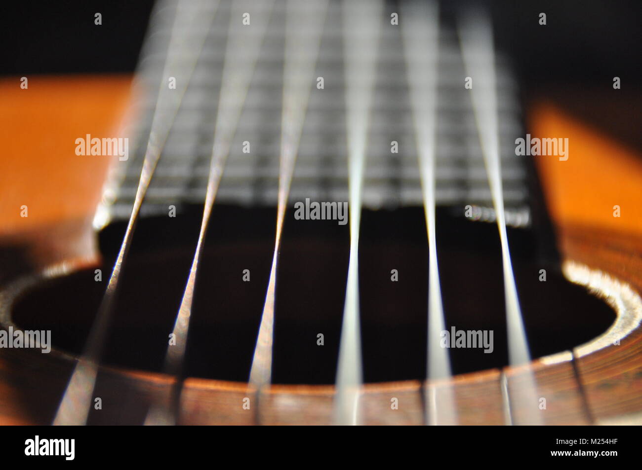 Classical guitar. Issuing a stringed instrument sounds. Fretboard ...