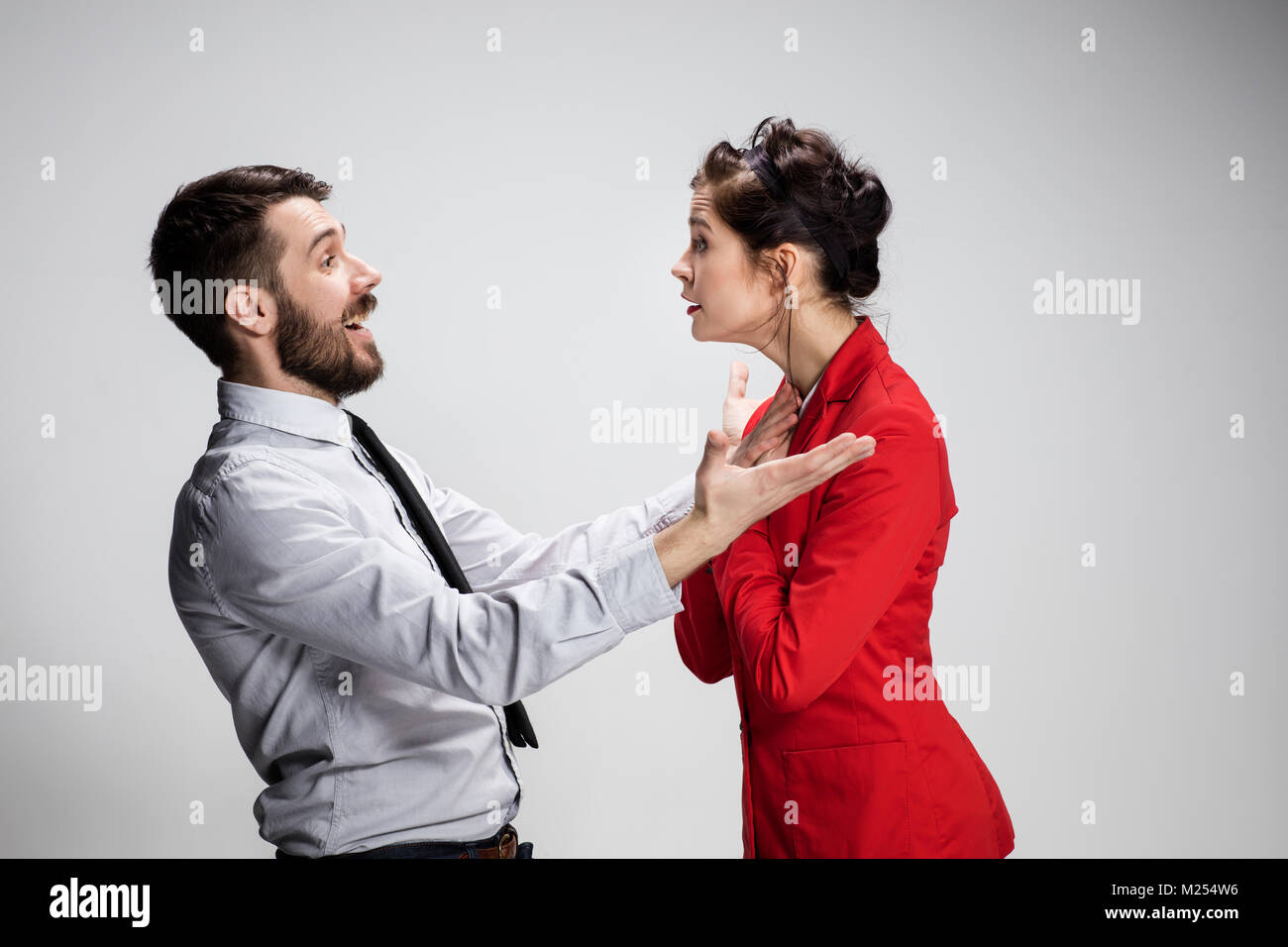 The business man and woman communicating on a gray background Stock ...