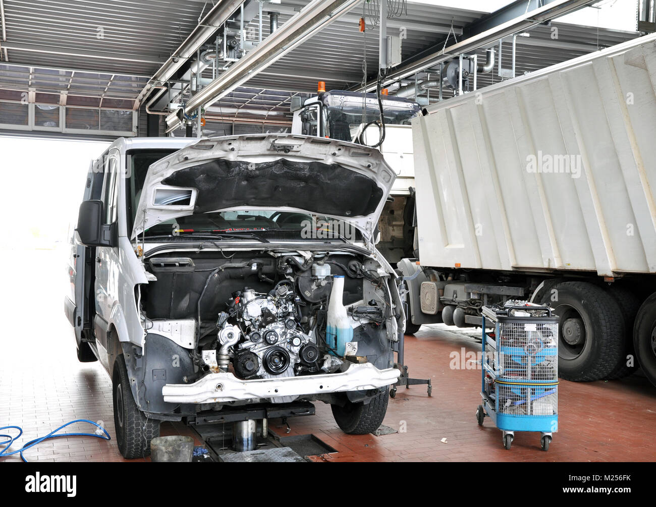 vehicles in a garage - repair and inspection of cars on a lifting ...