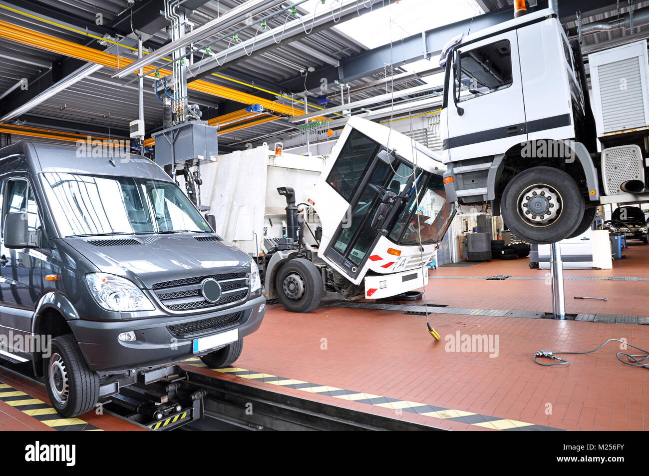 vehicles in a garage - repair and inspection of cars on a lifting ...