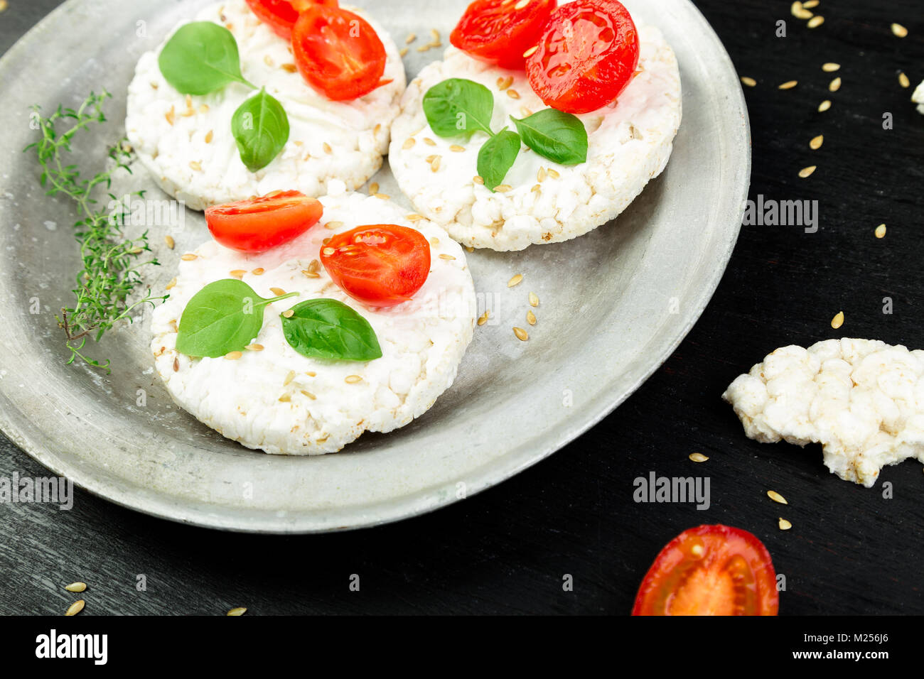 Healthy Rice Cakes with cherry tomatoes, cheese feta, basil and sesame ...