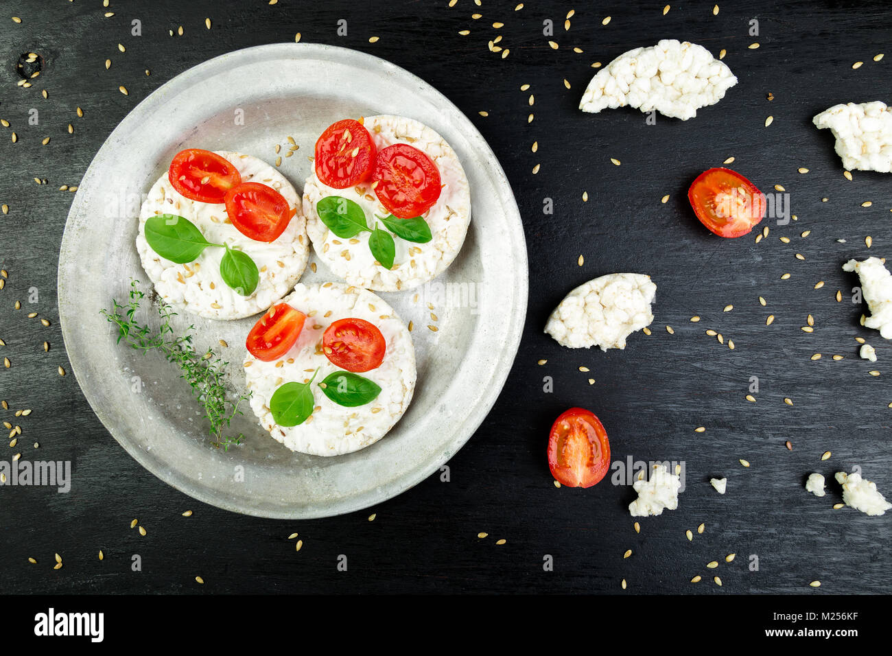 Healthy Rice Cakes with cherry tomatoes, cheese feta, basil and sesame ...