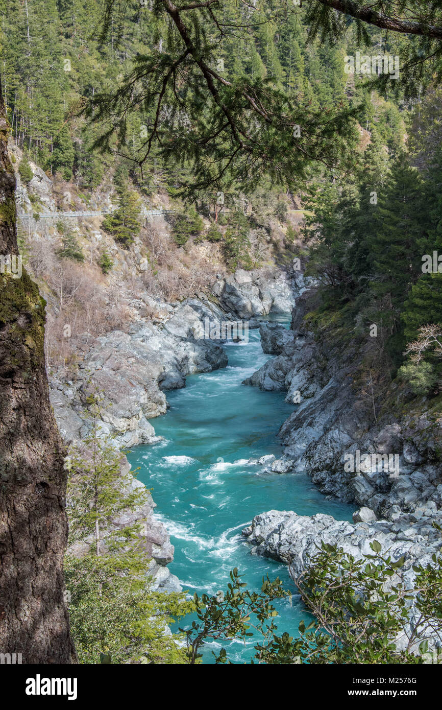 Cold Blue River running down through the rocky mountains Stock Photo ...