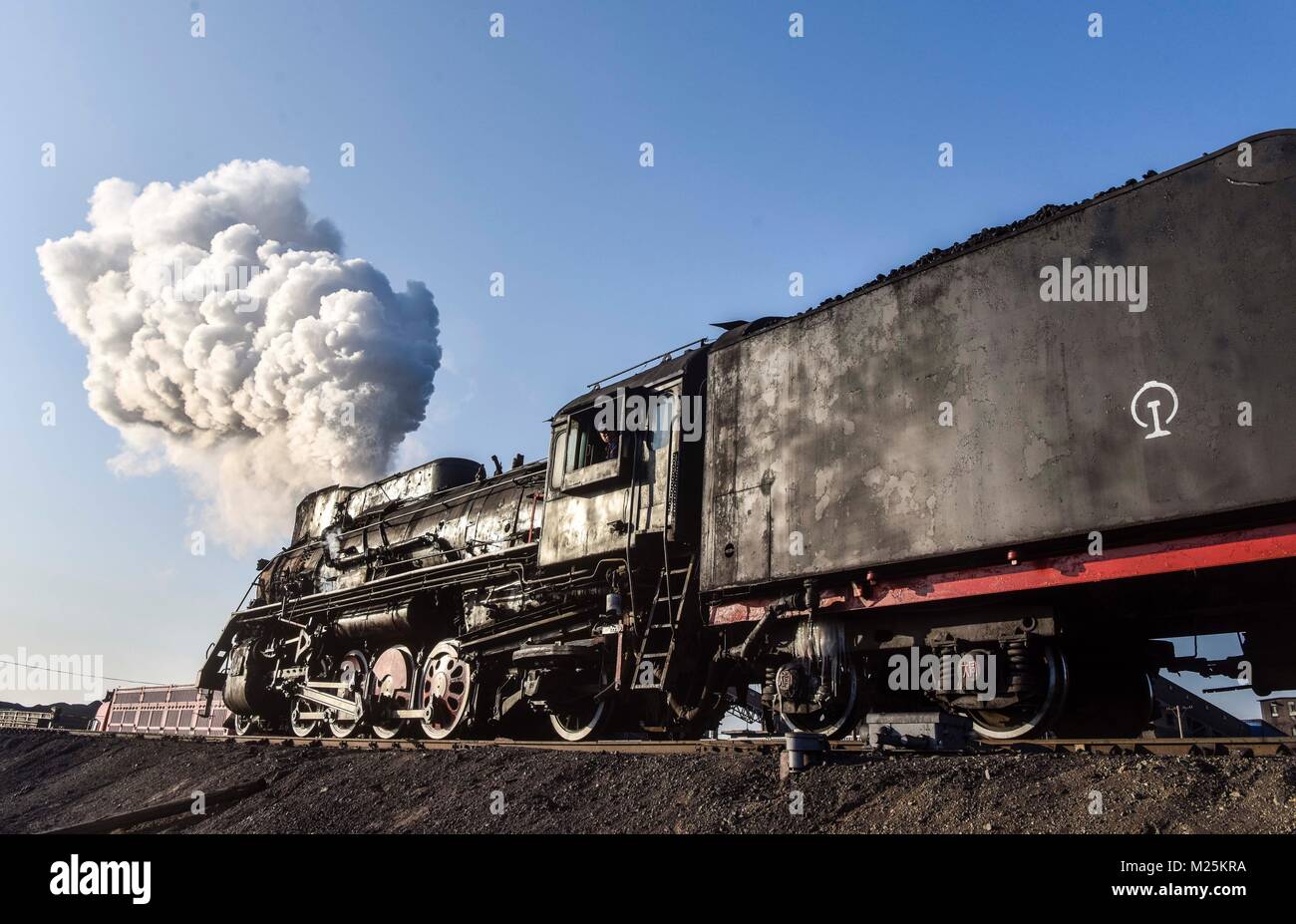 Photo taken on Jan. 18, 2018 shows a steam locomotive running at ...