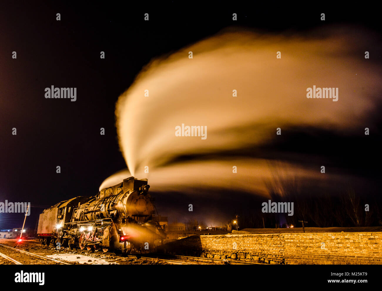 Photo taken on Jan. 19, 2018 shows a steam locomotive running at ...