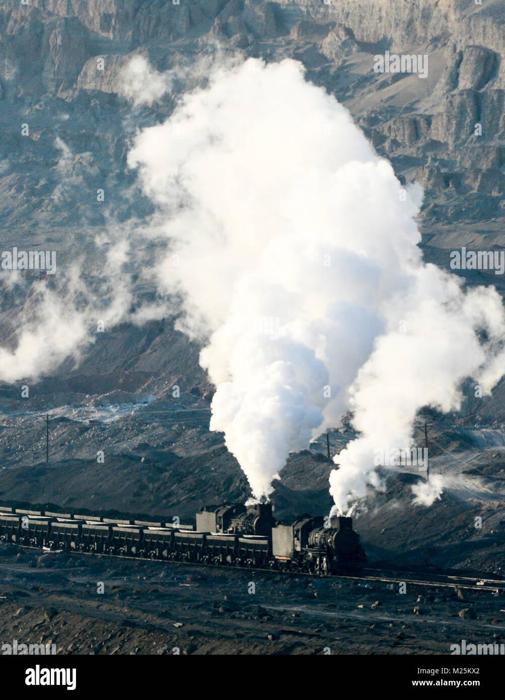 Photo taken on Jan. 19, 2018 shows steam locomotives carrying coals at ...