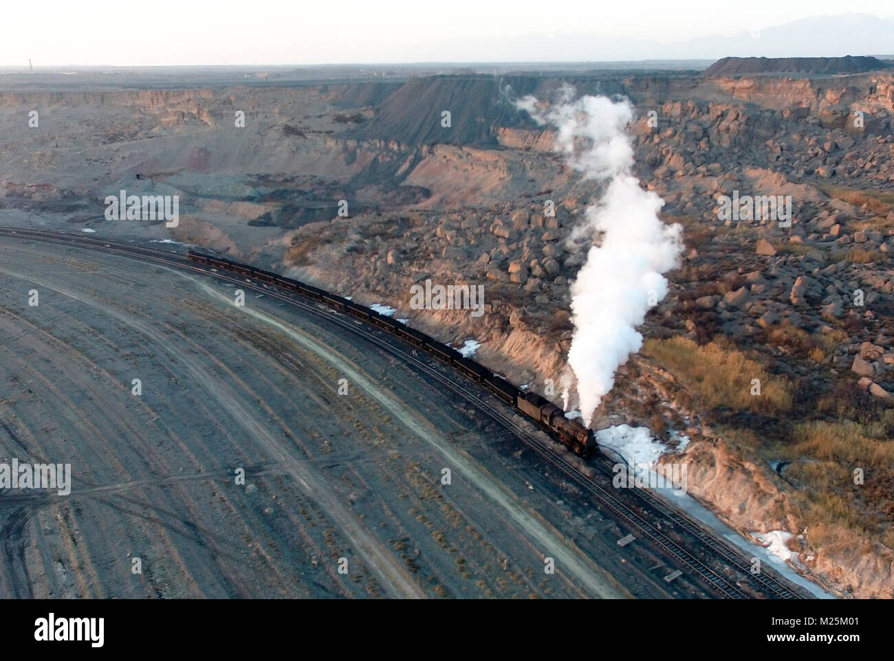 Photo taken on Jan. 19, 2018 shows a steam locomotive carrying coals at ...
