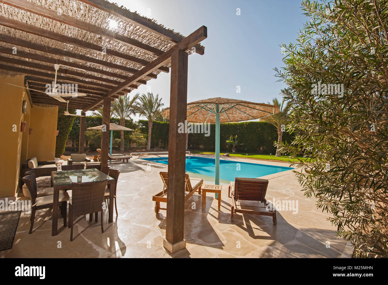 Luxury villa show home at tropical summer holiday resort with swimming ...