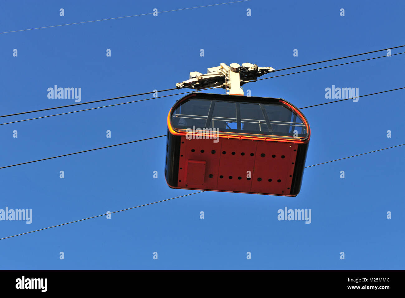 Modern Cable car in the blue sky Stock Photo - Alamy