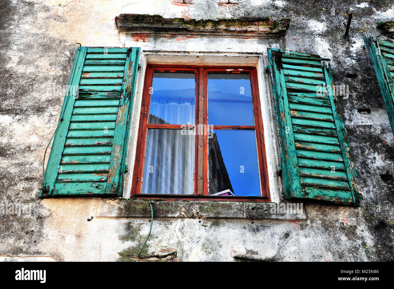 Open window with green wooden frames in old town Stock Photo - Alamy