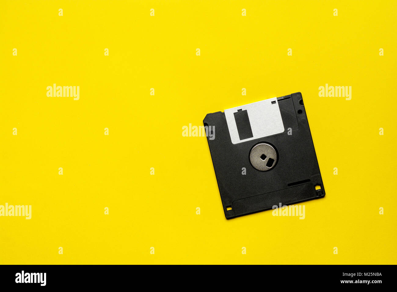 floppy data storage diskette on yellow background with copy space Stock ...