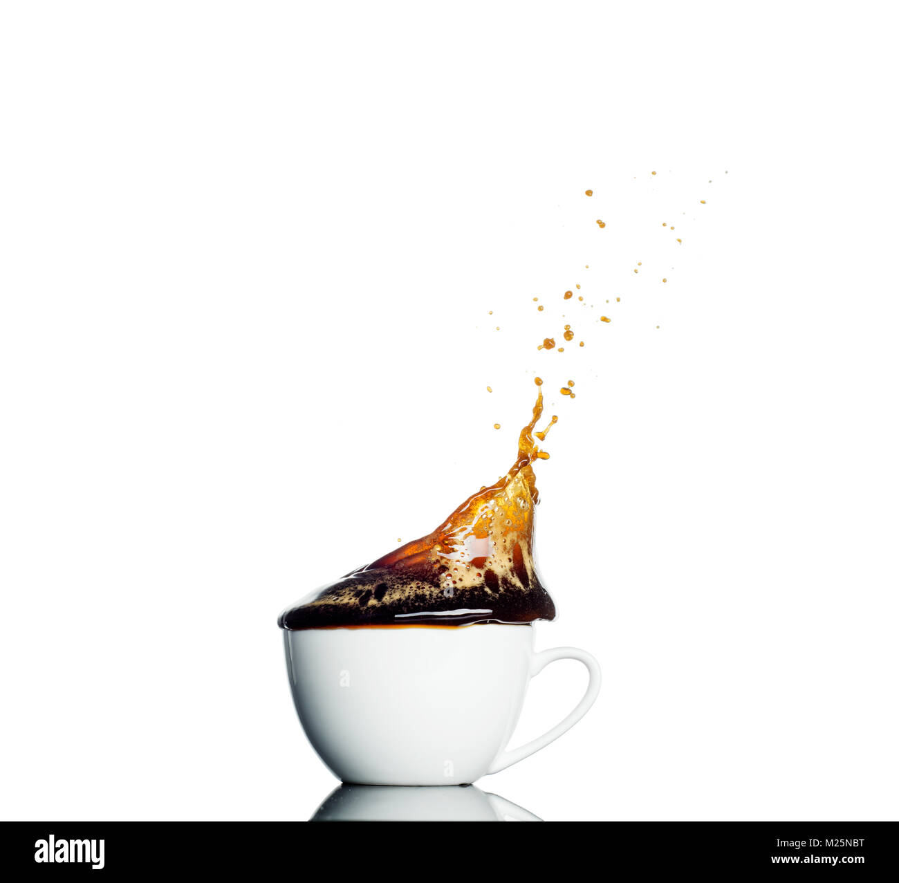 cup of spilling coffee creating splash isolated on white background ...