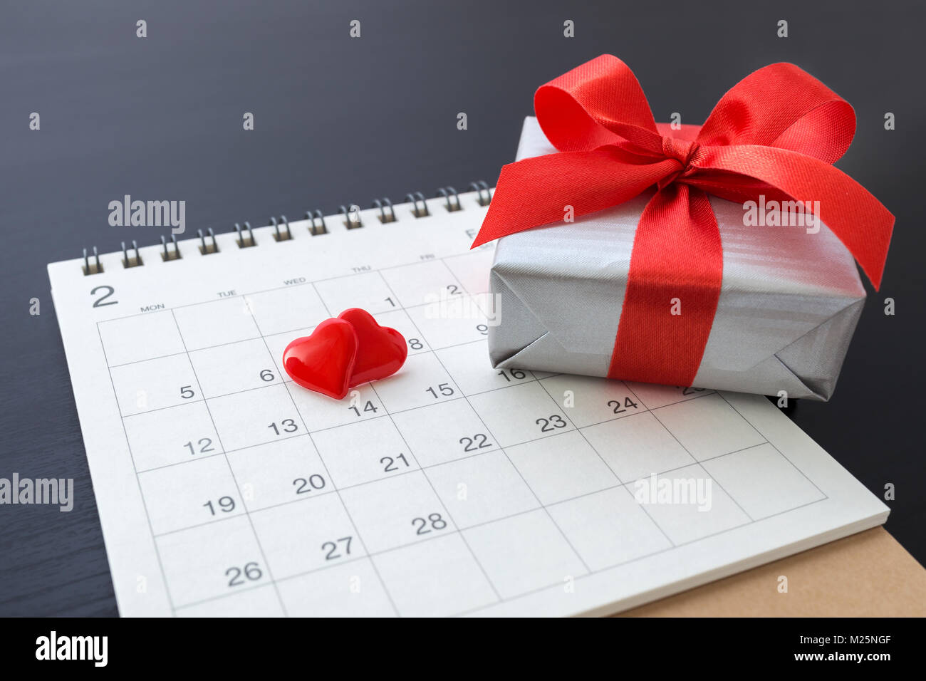 Valentines day with red hearts on calendar and gift box Stock Photo - Alamy