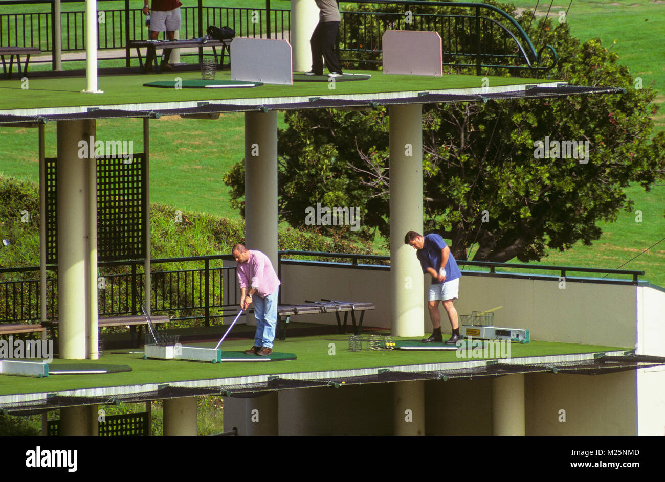 Golfers on the multi-level driving range at Moore Park Golf Course in ...