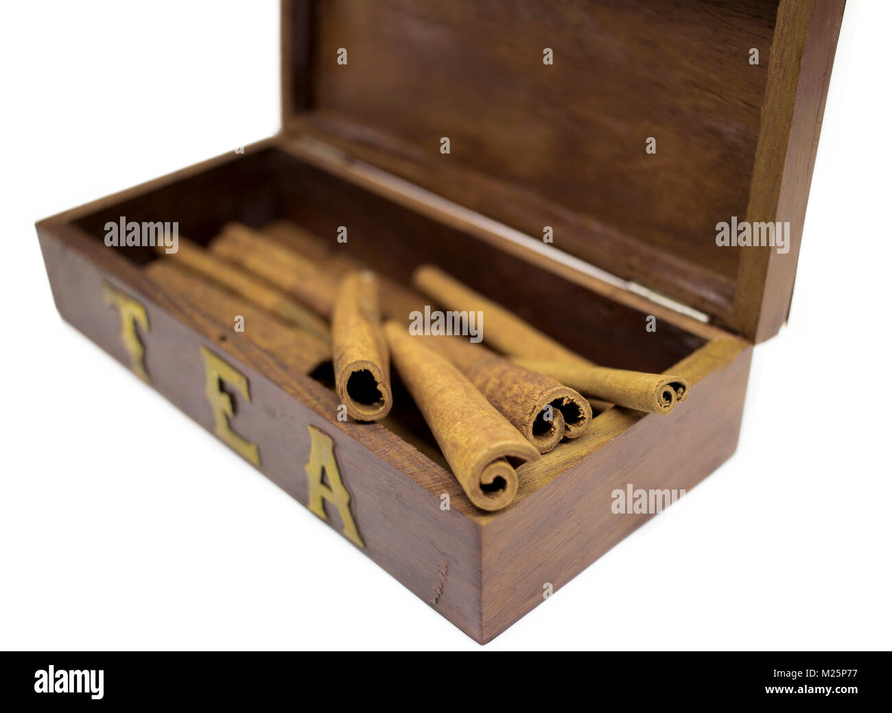 Cinnamon in wooden box isolated on white Stock Photo - Alamy