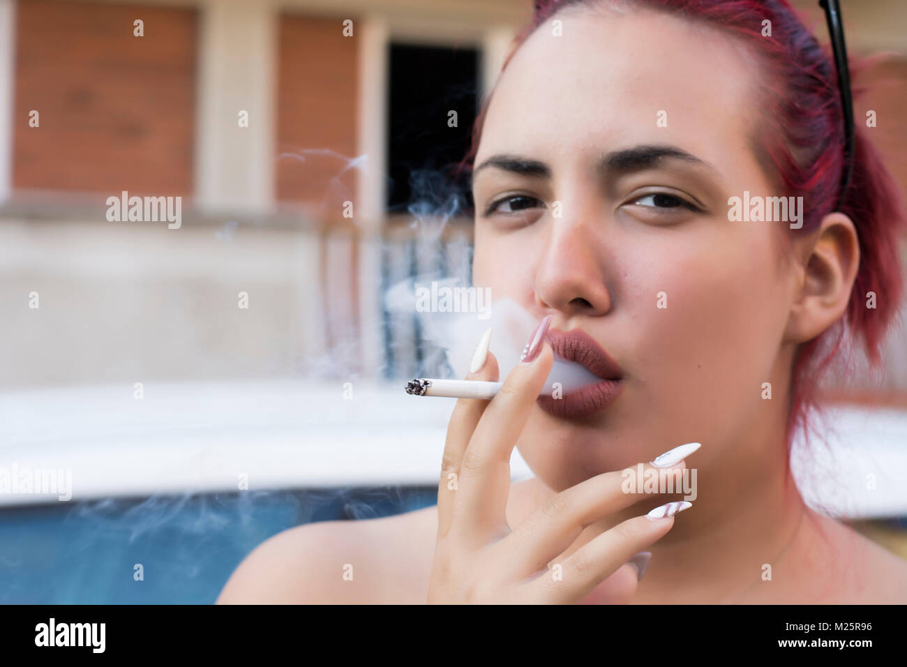 Student's break for cigarette in front of student dormitory Stock Photo ...