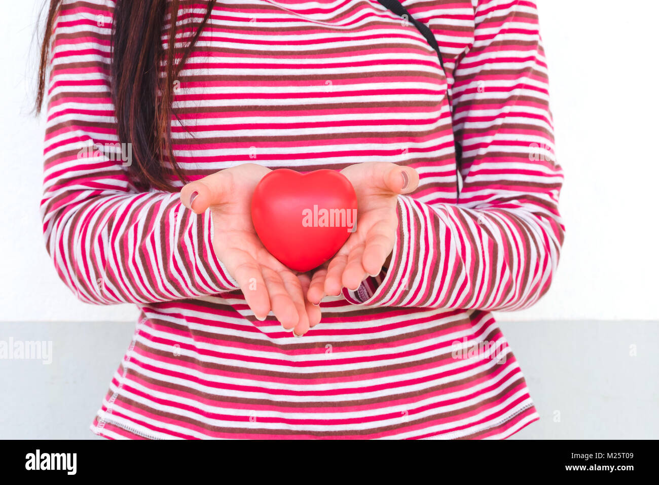 red heart sign in hand Stock Photo - Alamy