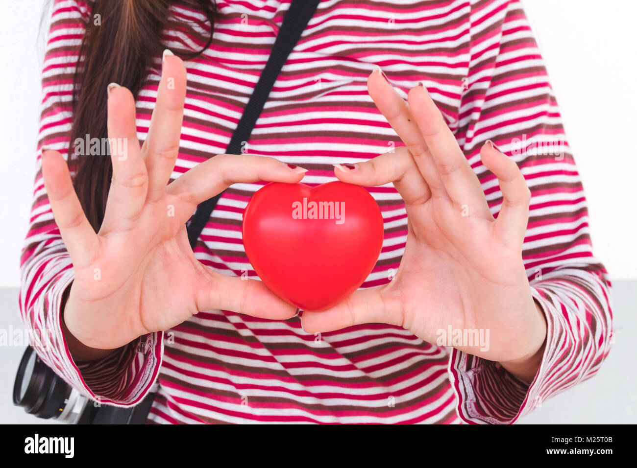red heart sign in hand Stock Photo - Alamy