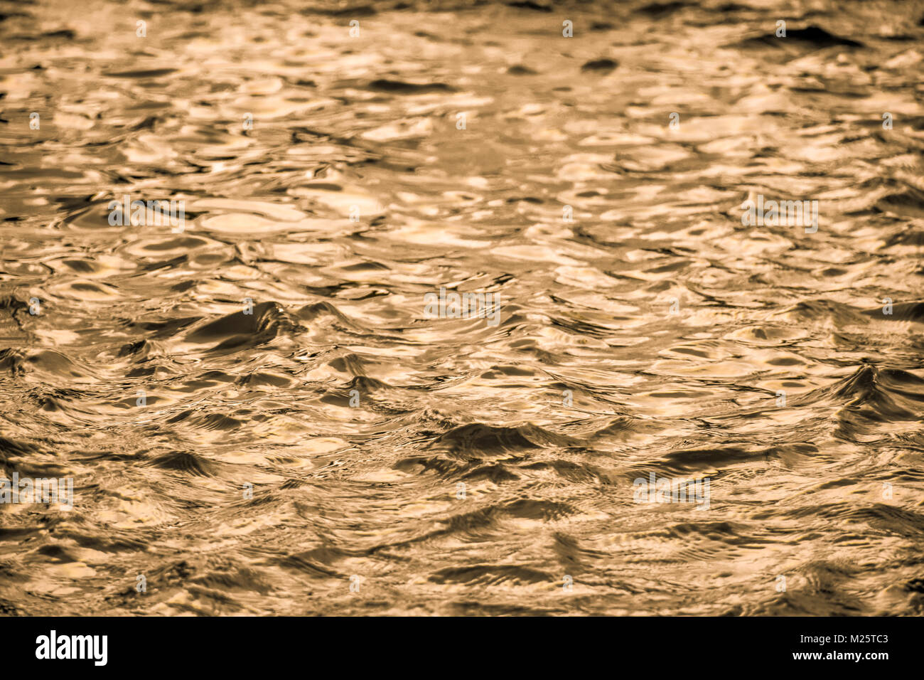 Golden water surface with soft waves abstract background Stock Photo ...