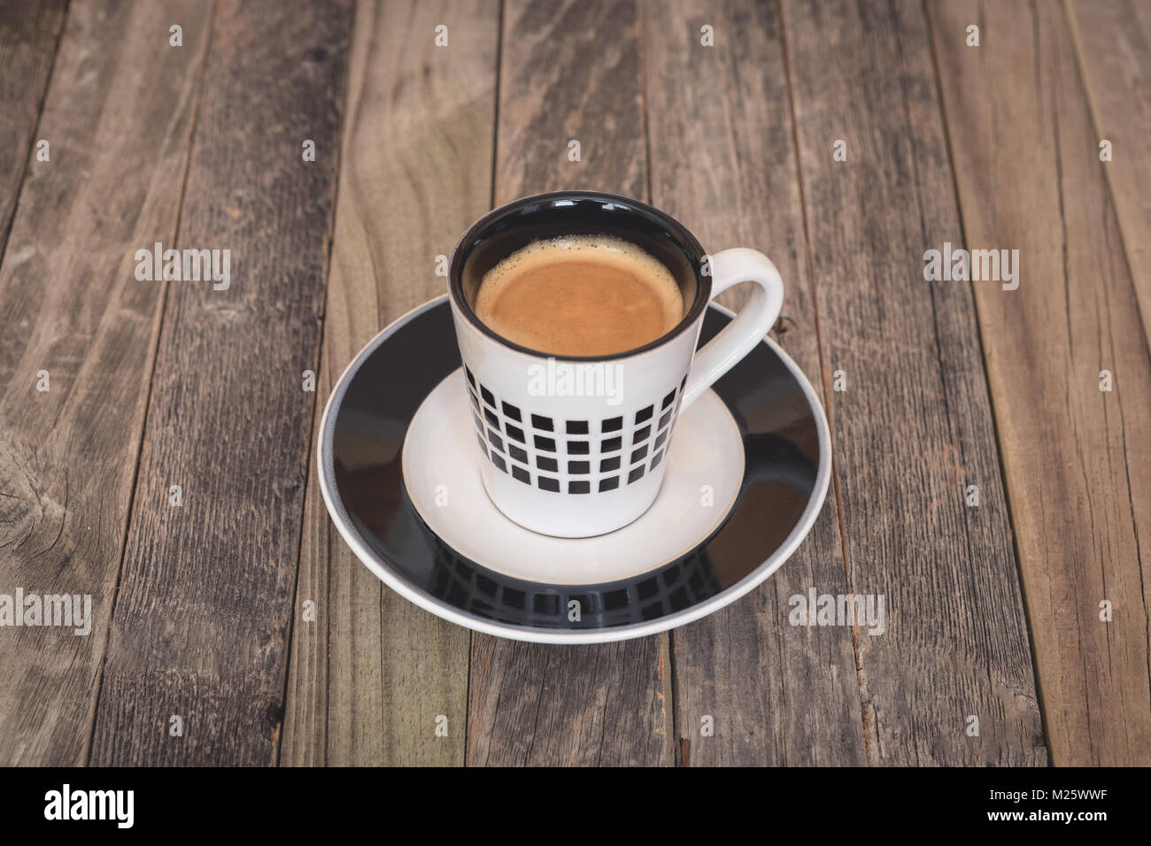 Single small espresso coffee cup on wooden background. Side view Stock ...