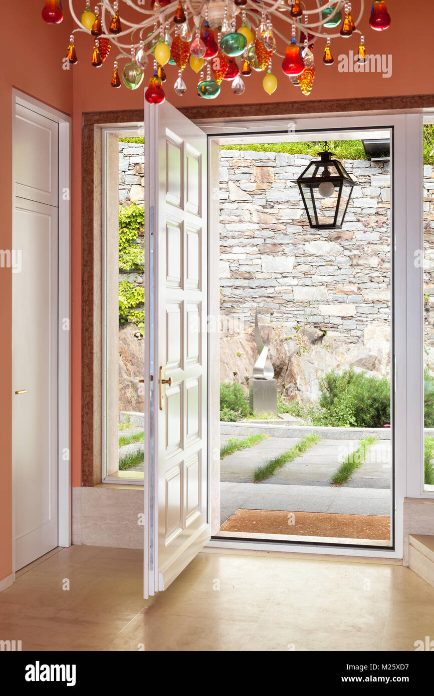 Interior, luxury villa, entrance, door open Stock Photo - Alamy