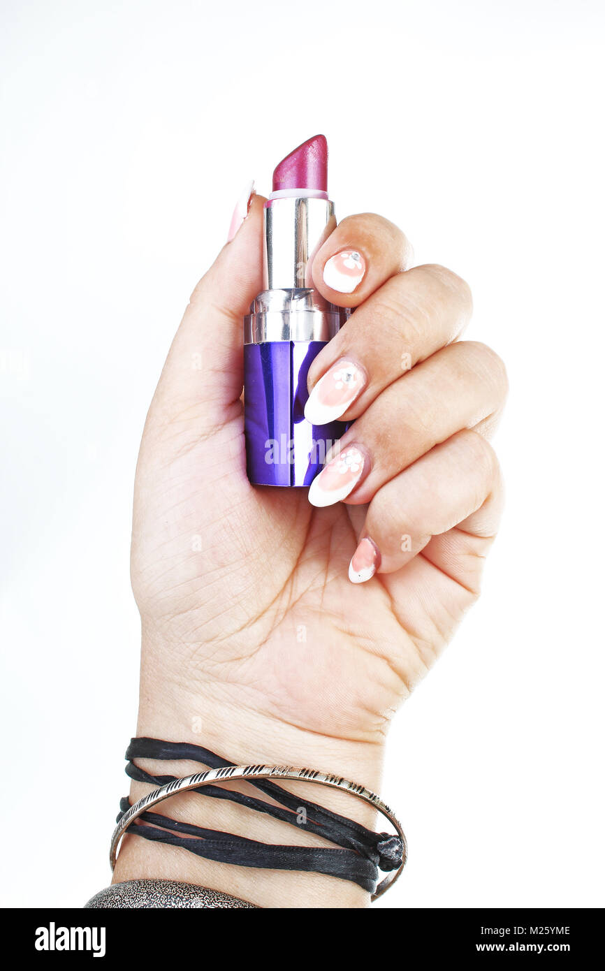 Woman hand holding red lipstick on isolated white cutout background ...