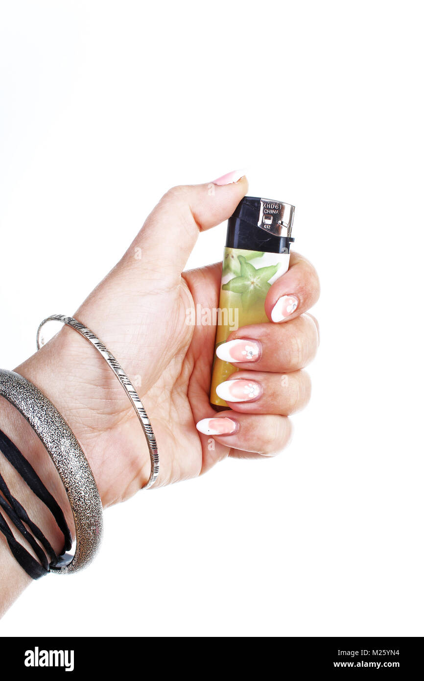 .Woman hand holding lighter on isolated white cutout background. Studio ...