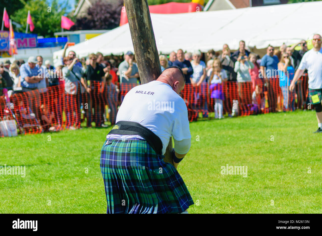 Male prepares to compete in tossing the caber competition at the ...