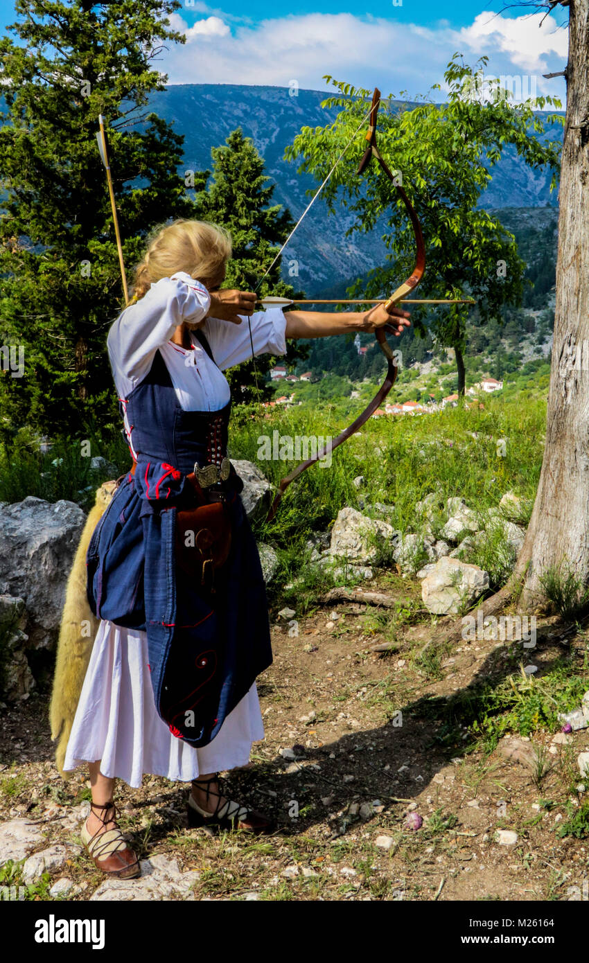 Beautiful woman aiming bow arrow hi-res stock photography and images ...