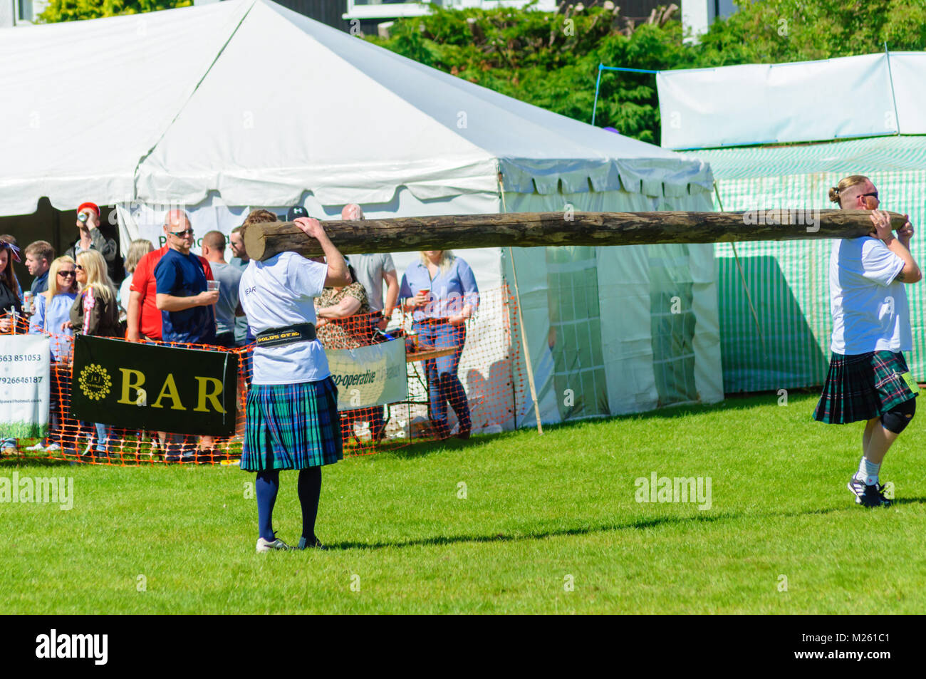 Male prepares to compete in tossing the caber competition at the ...