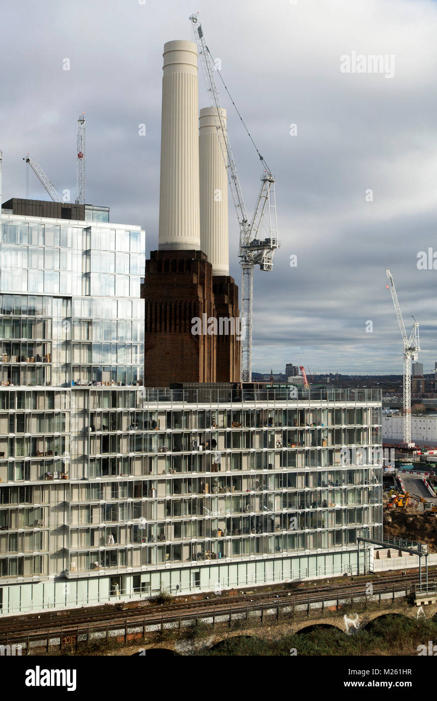 Battersea Power Station rises above a modern building in London ...