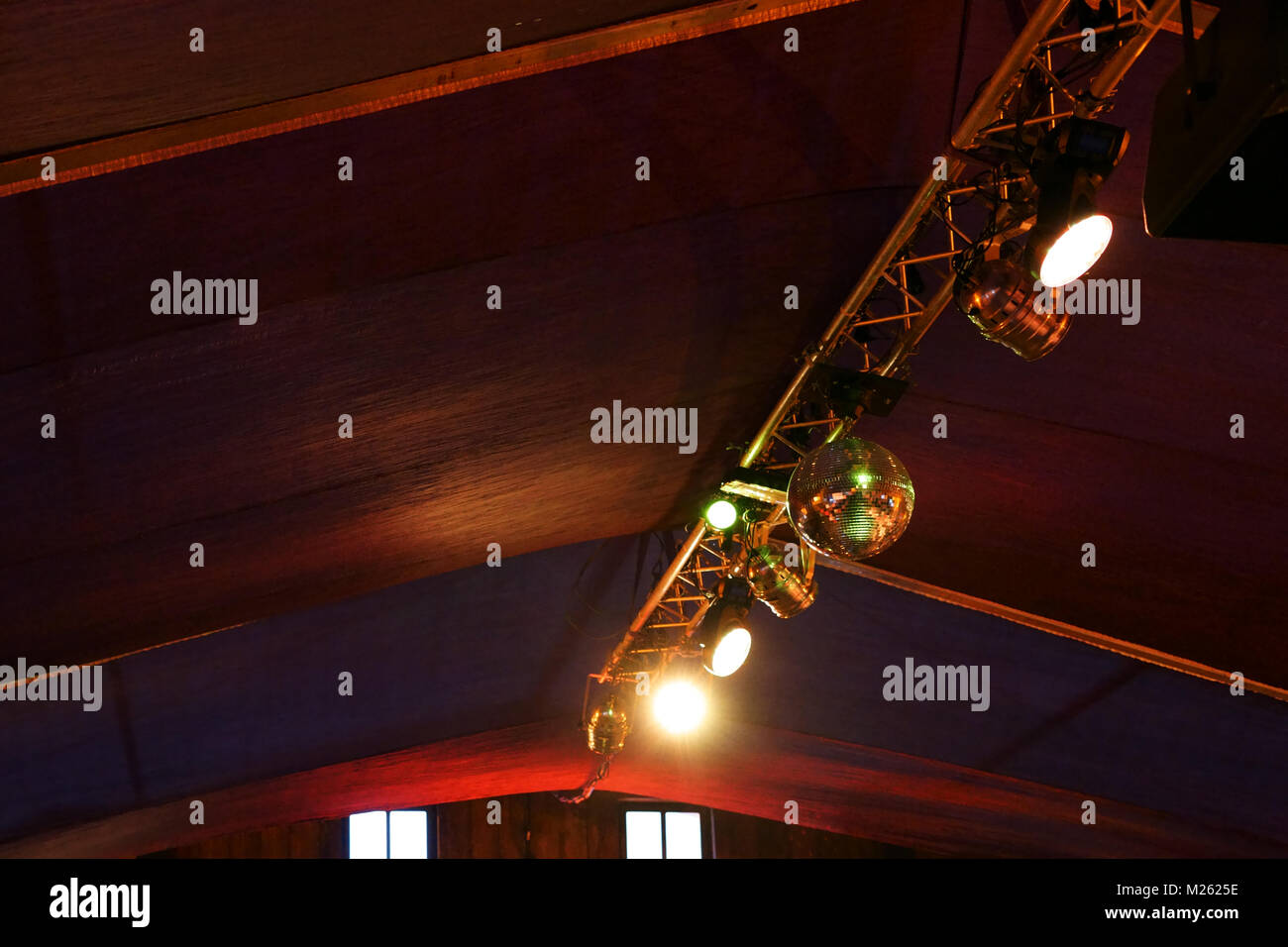 A lighting system with disco lights, light emitters and a disco ball ...